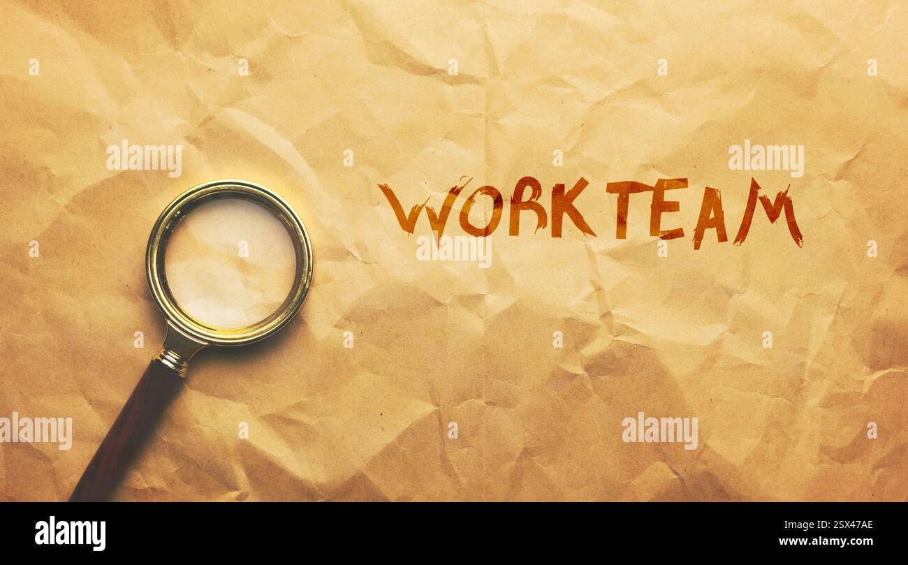 work team text written on crumpled paper with magnifier Stock Photo - Alamy