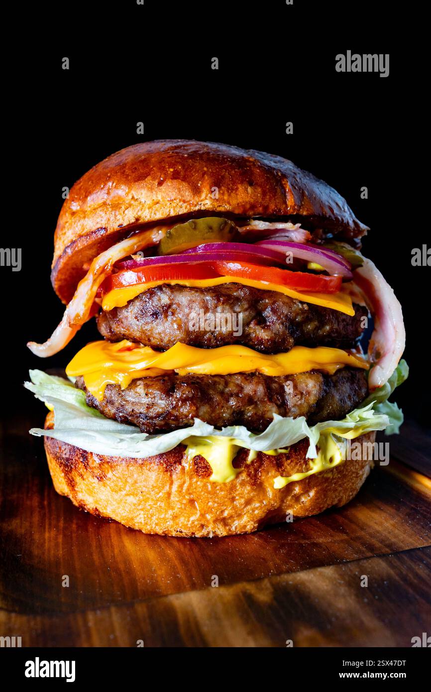 A delicious double cheeseburger stacked high with two beef patties ...