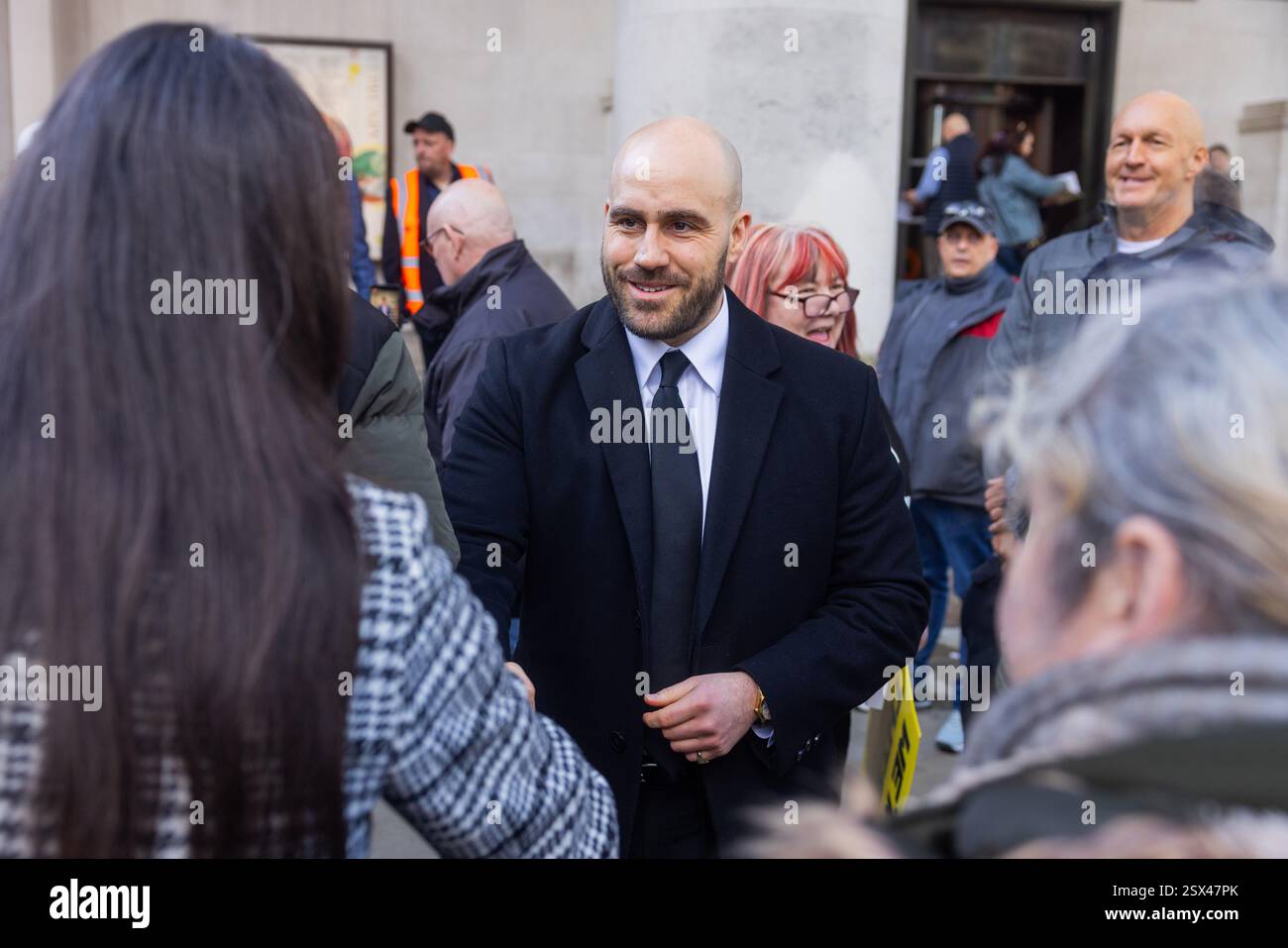 Manchester, UK. 22 FEB, 2025. Nick Tenconi, leader of UKIP, greets a ...
