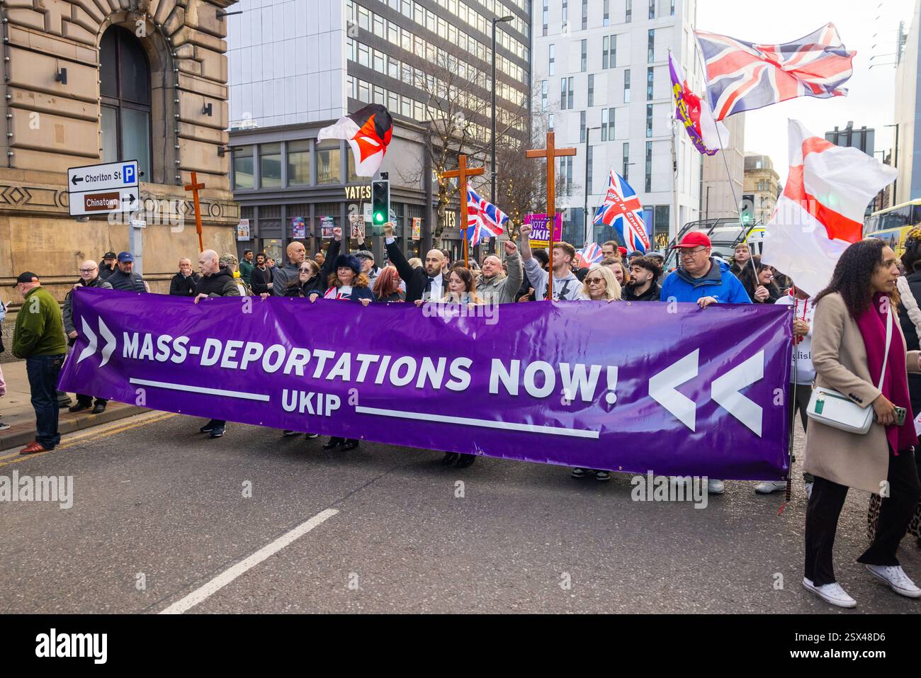 Manchester, UK. 22 FEB, 2025. Nick Tenconi, leader of Ukip, raises a ...