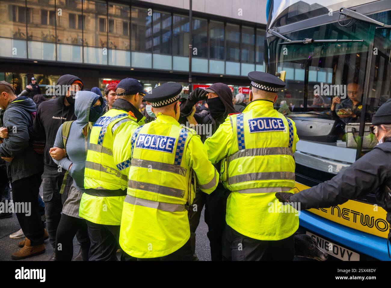 Manchester, UK. 22 FEB, 2025. Police kettle counter demonstrator as ...