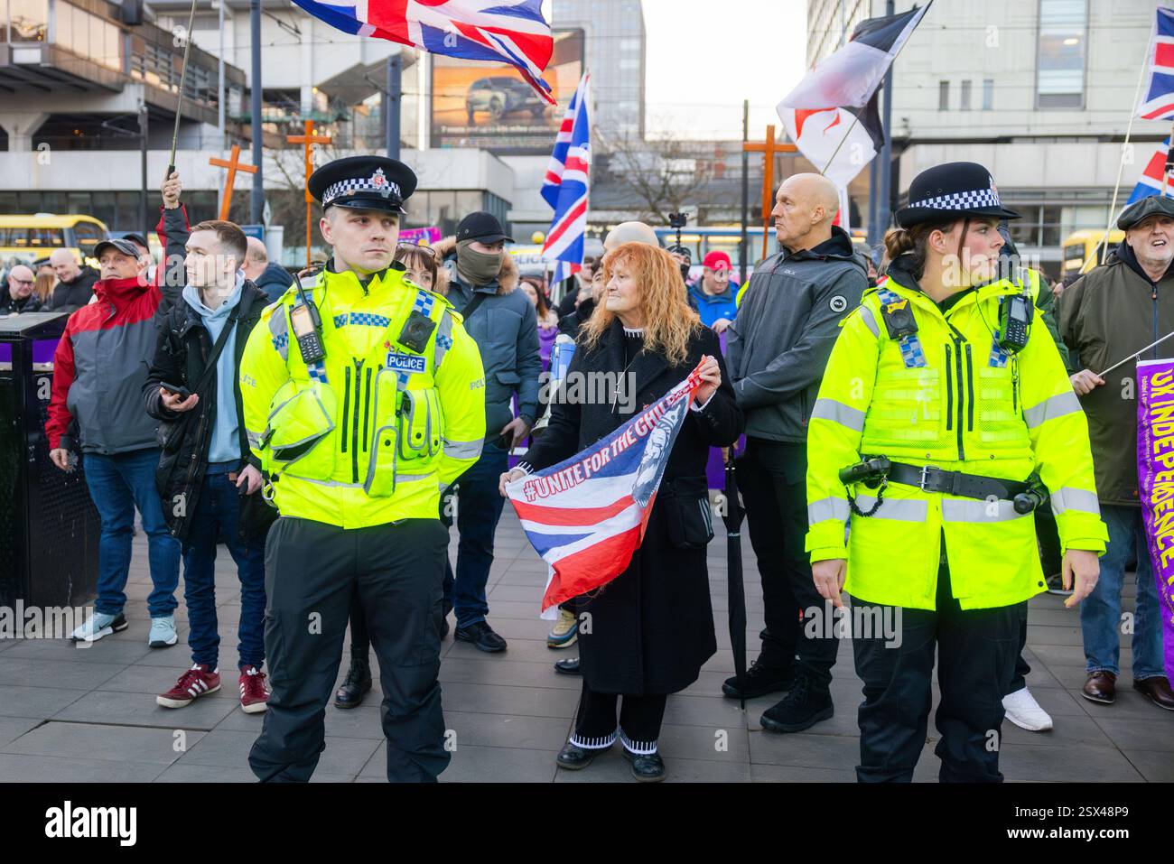 Manchester, UK. 22 FEB, 2025. Activists wave flags as protestors from ...