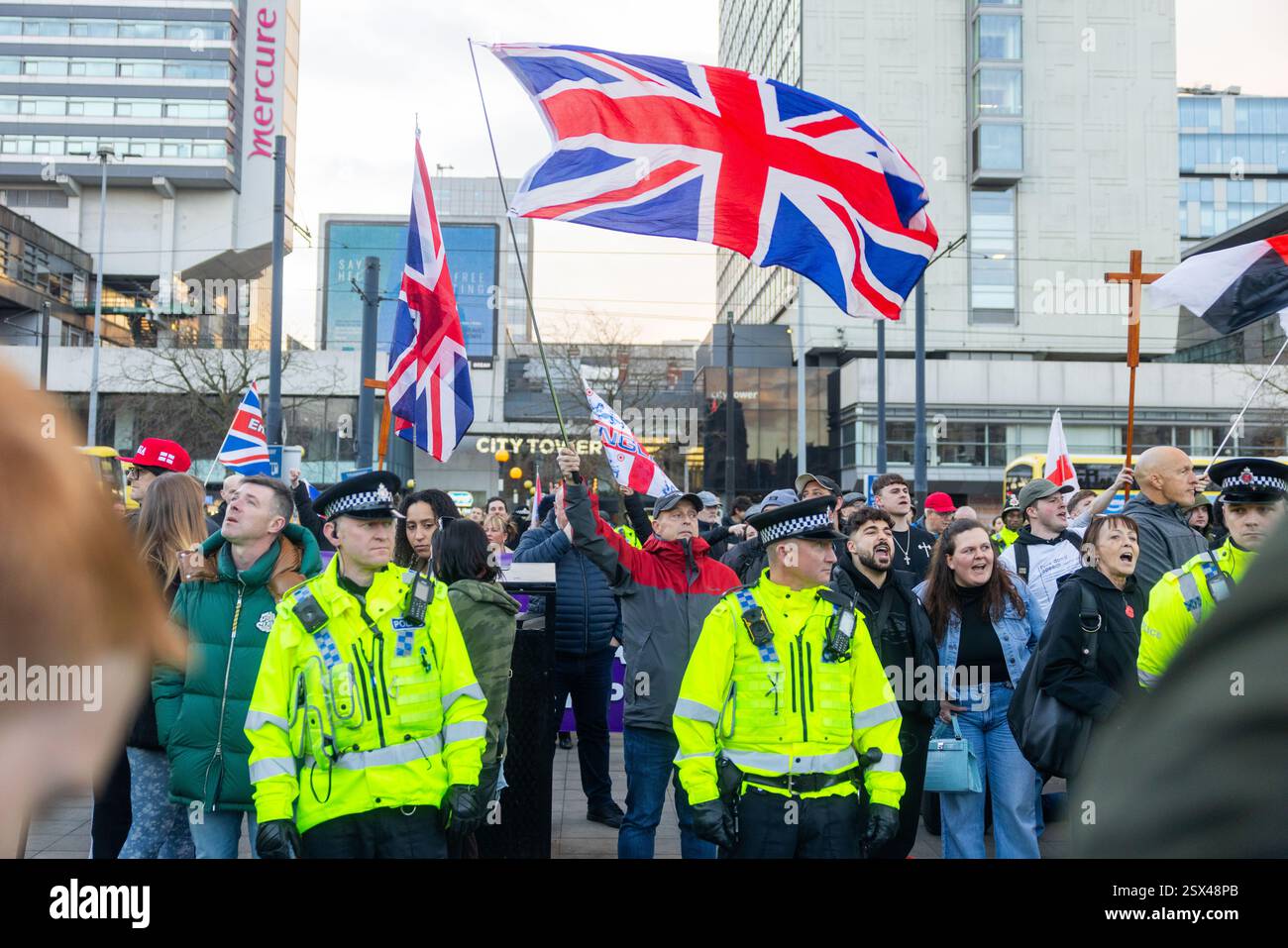 Manchester, UK. 22 FEB, 2025. Activists wave flags as protestors from ...