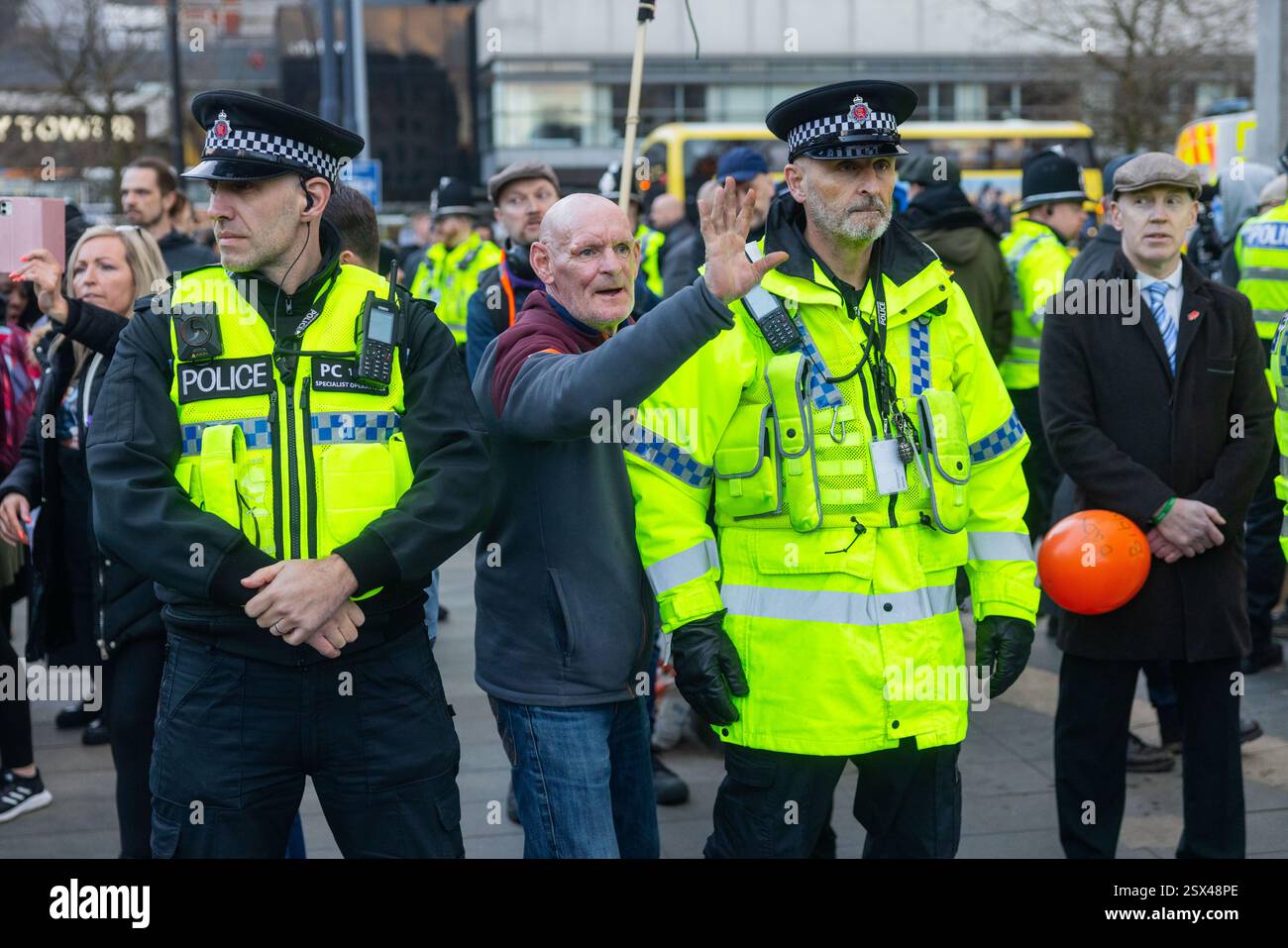 Manchester, UK. 22 FEB, 2025. Activists chant towards rival group as ...