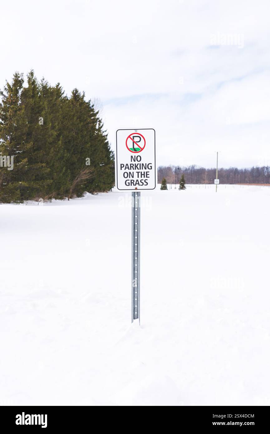Sign advising motorists to refrain from parking on the grass although ...