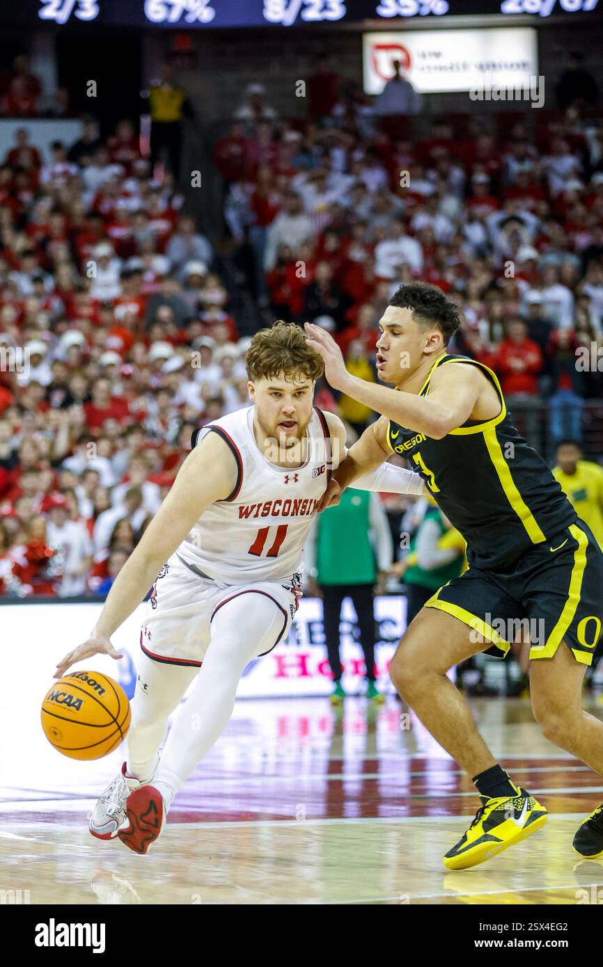 MADISON, WI - FEBRUARY 22: Wisconsin guard Max Klesmit (11) tries to ...