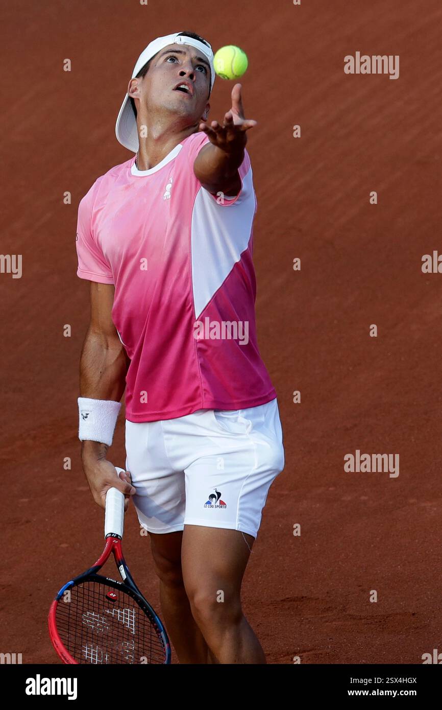 Argentina's Sebastian Baez serves to Argentina's Camilo Ugo Carabelli, during a semifinal match ...