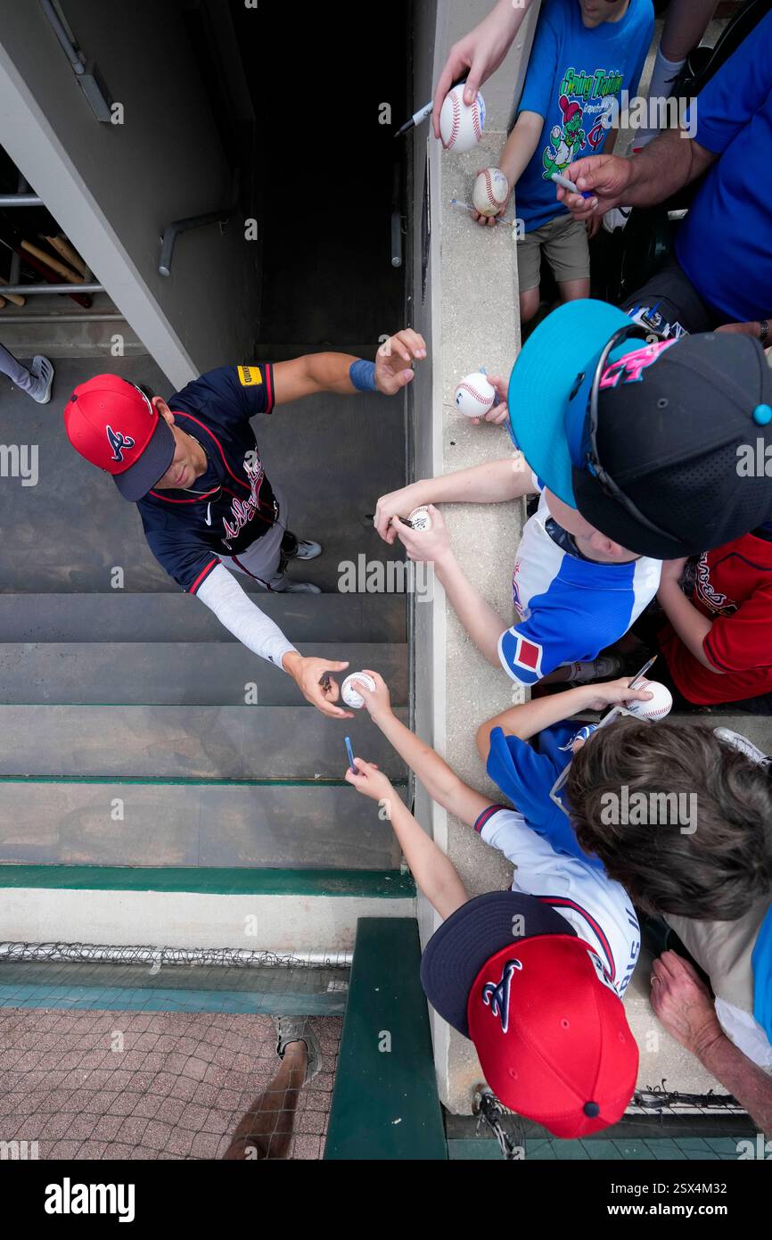 Atlanta Braves Christian Cairo signs autographs from the dugout before ...