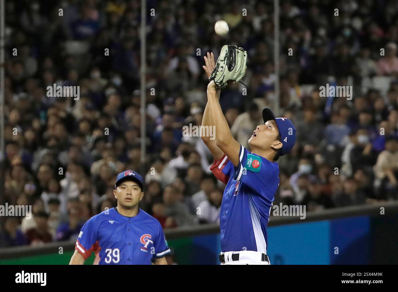Taiwan pitcher Tzu-Chen Sha (98) catches a pop-fly for an out by South Africa'' Jason Carelse ...