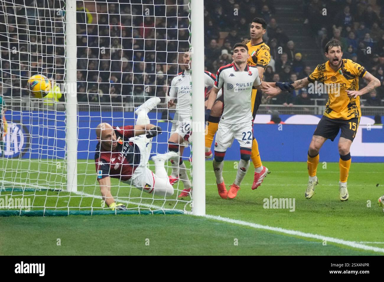 Genoa's goalkeeper Nicola Leali, left, dives but fails to save the goal ...
