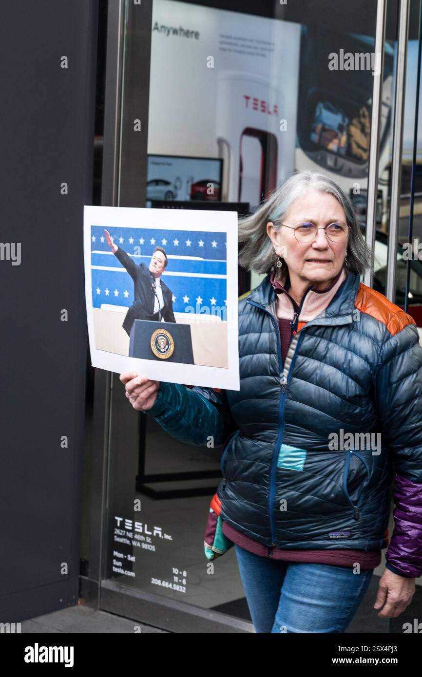 Seattle, USA. 22 Feb 2025. Activists at the Tesla dealership in the U ...