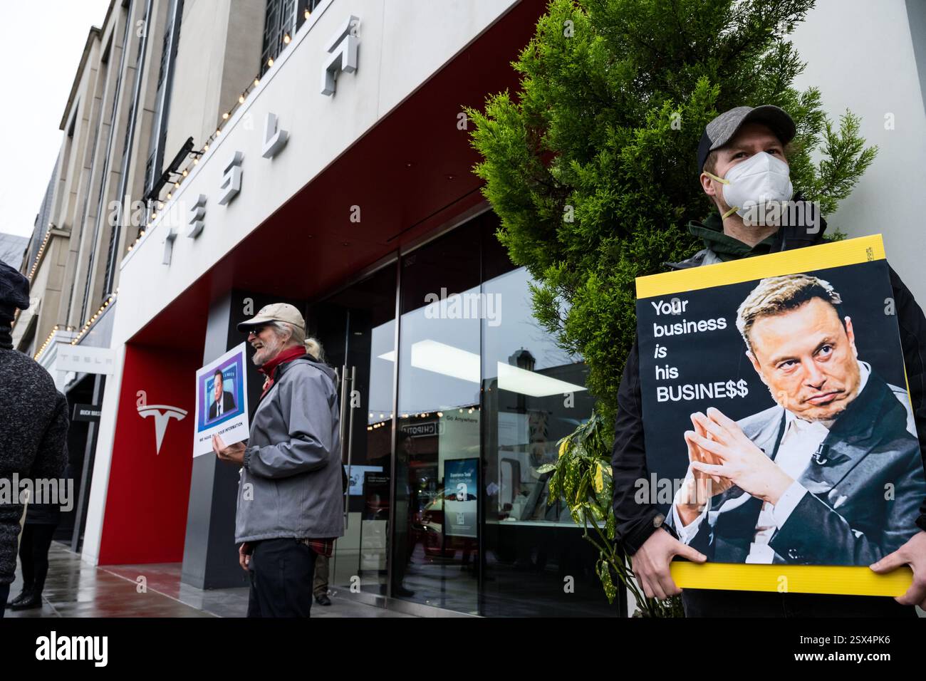 Seattle, USA. 22 Feb 2025. Activists at the Tesla dealership in the U ...