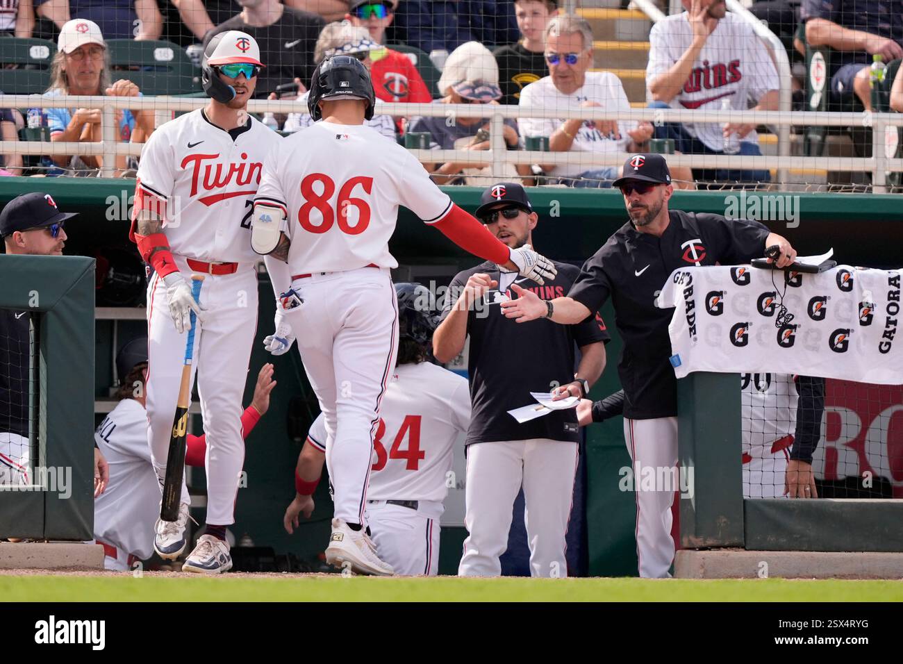 Minnesota Twins Kala'i Rosario (86) is greeted at the dugout after his ...