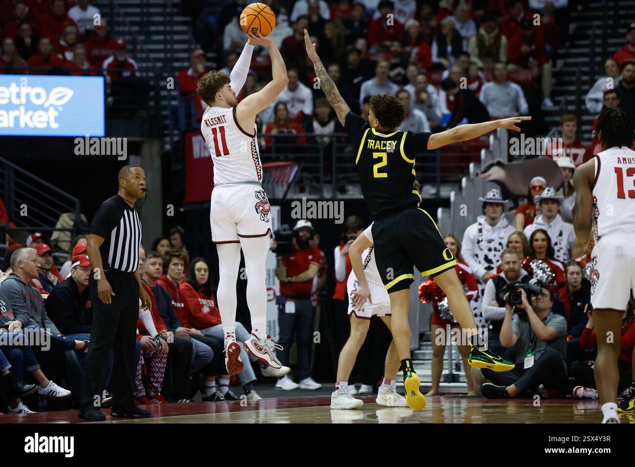 Madison, WI, USA. 22nd Feb, 2025. Wisconsin Badgers guard Max Klesmit (11) attempts a 3 point ...