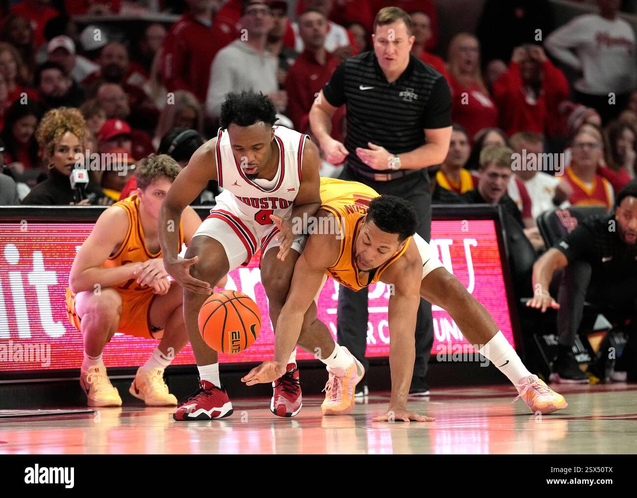 Houston guard L.J. Cryer (4) and Iowa State forward Joshua Jefferson ...