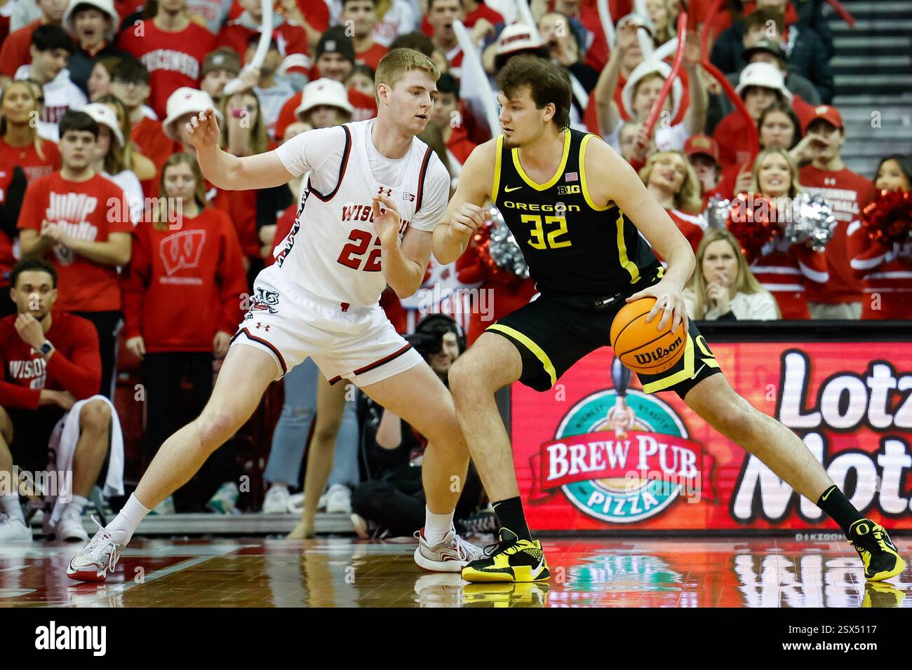 February 22, 2025: Oregon Ducks center Nate Bittle (32) posts up Wisconsin Badgers forward ...
