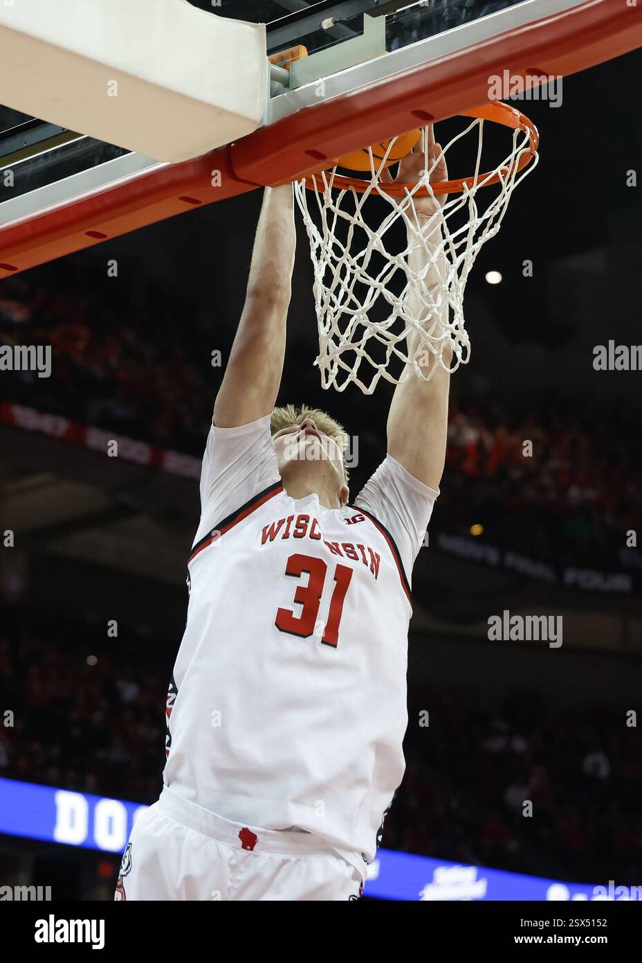 Madison, WI, USA. 22nd Feb, 2025. Wisconsin Badgers forward Nolan ...