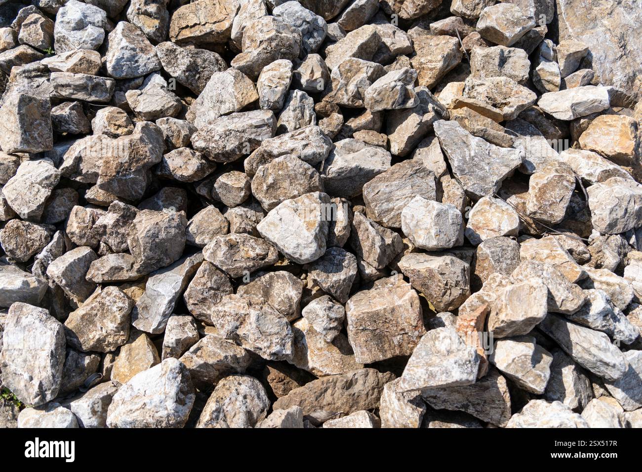 Pile of crushed gray stones for construction Stock Photo - Alamy