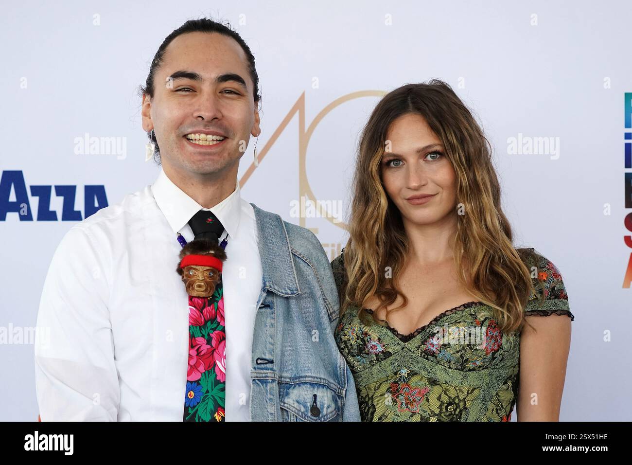 Julian Brave NoiseCat, left, and Emily Kassie arrive at the Film Independent Spirit Awards on ...
