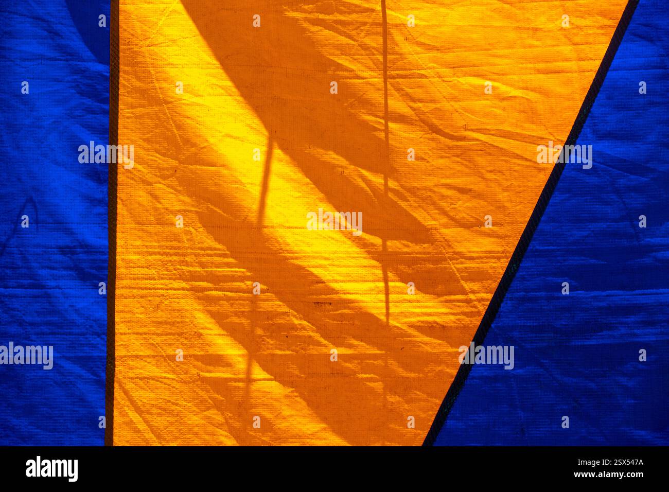 Colorful texture of old circus tent forming blue and yellow geometric ...