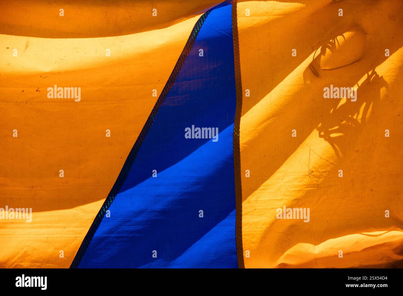 Colorful texture of old circus tent forming blue and yellow geometric ...