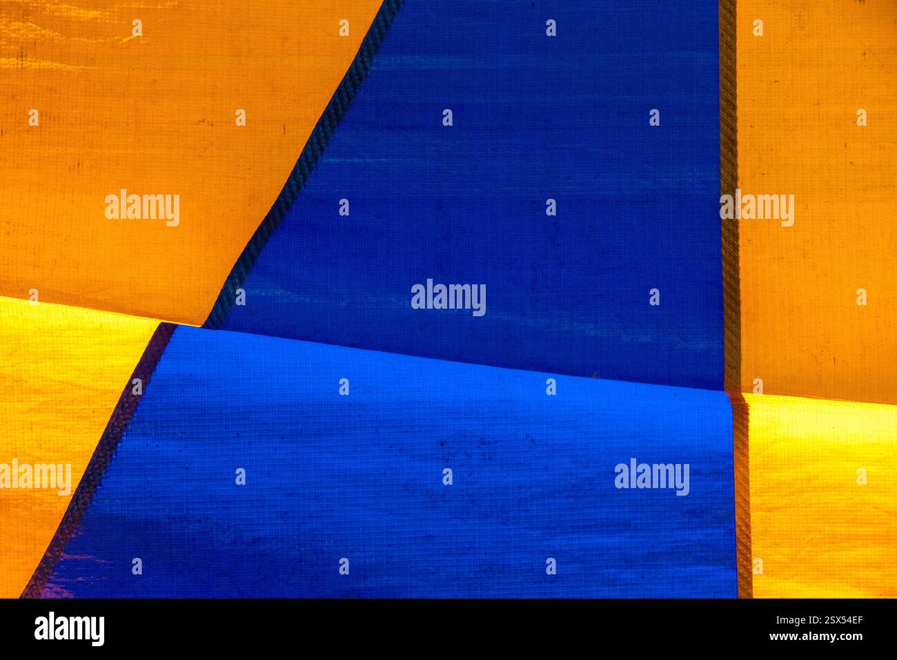 Colorful texture of old circus tent forming blue and yellow geometric ...