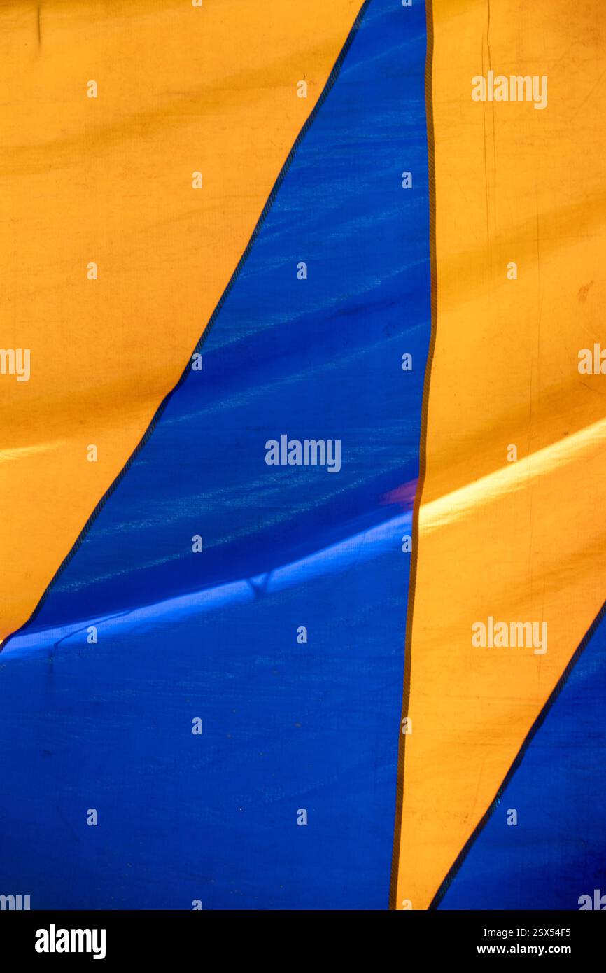 Colorful texture of old circus tent forming blue and yellow geometric ...