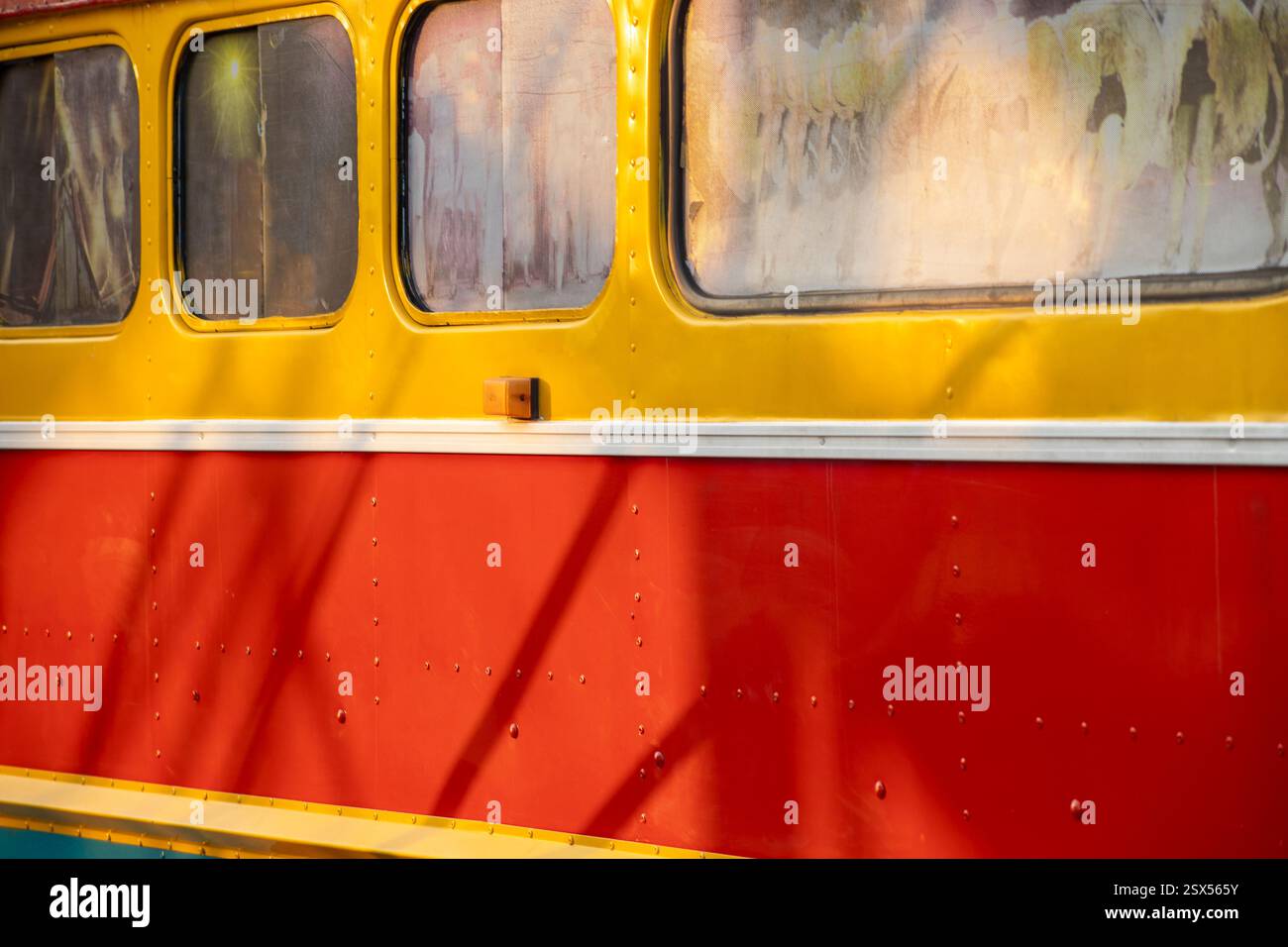 Abstract colorful shape on the metallic wall of an old bus. texture ...