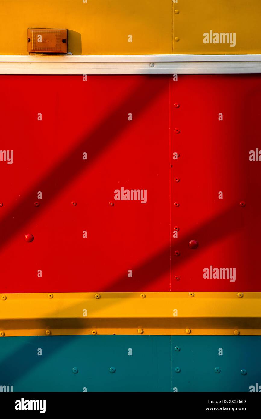 Abstract colorful shape on the metallic wall of an old bus. texture ...