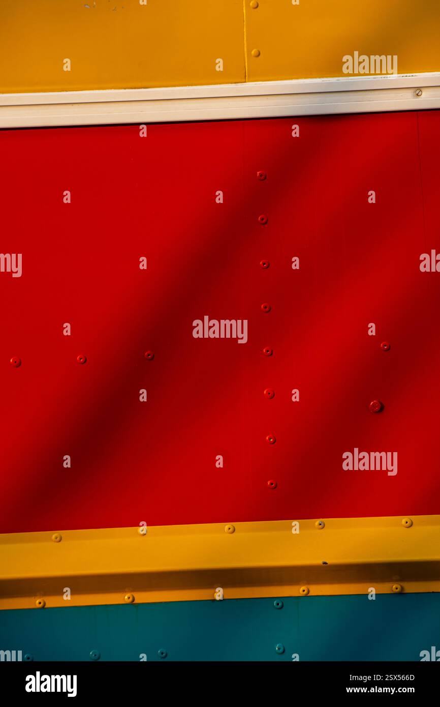 Abstract colorful shape on the metallic wall of an old bus. texture ...