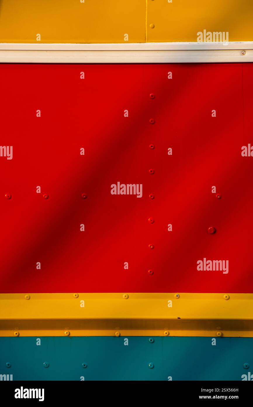 Abstract colorful shape on the metallic wall of an old bus. texture ...