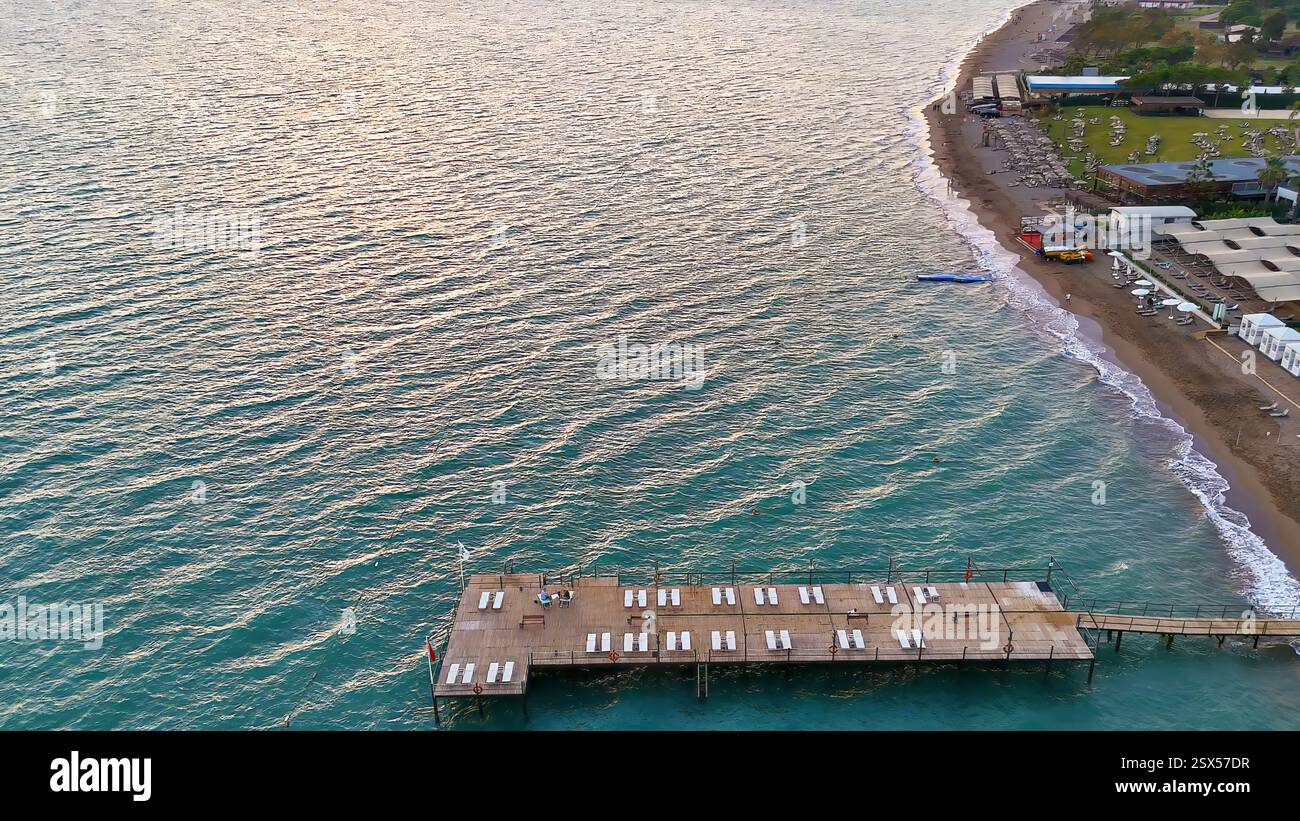 Wooden pier extending calm ocean hi-res stock photography and images ...
