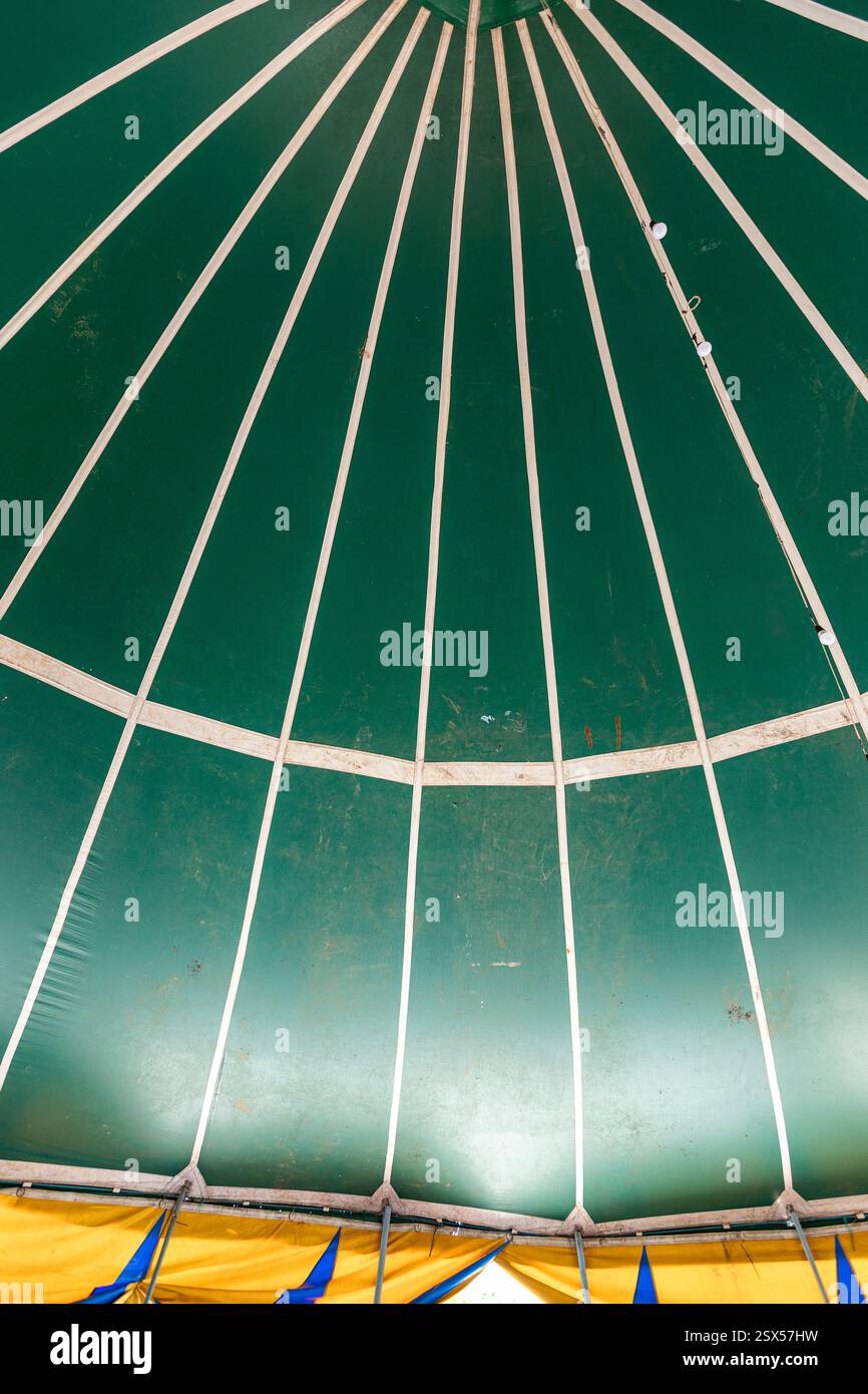 abstract images of a circus tent in green color with white stripes ...