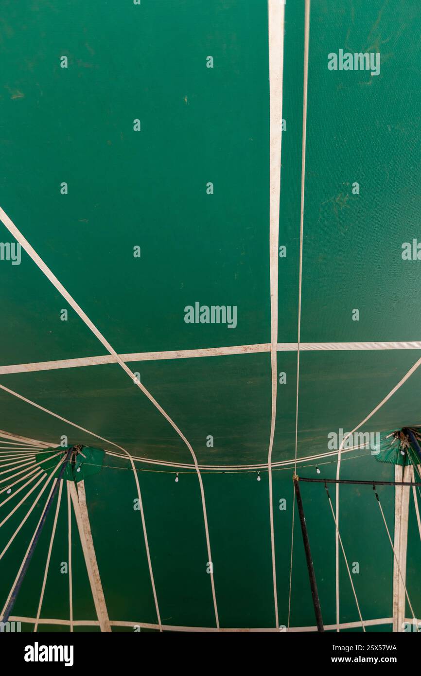 abstract images of a circus tent in green color with white stripes ...