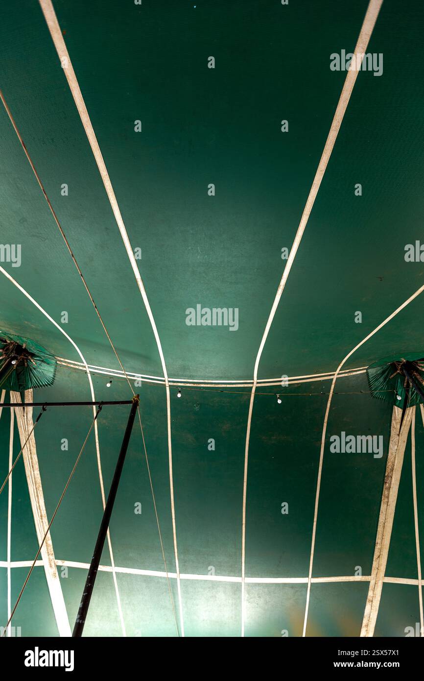 abstract images of a circus tent in green color with white stripes ...