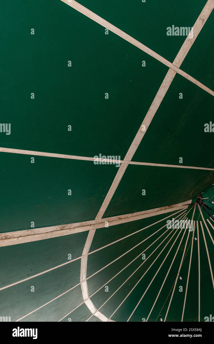 abstract images of a circus tent in green color with white stripes ...