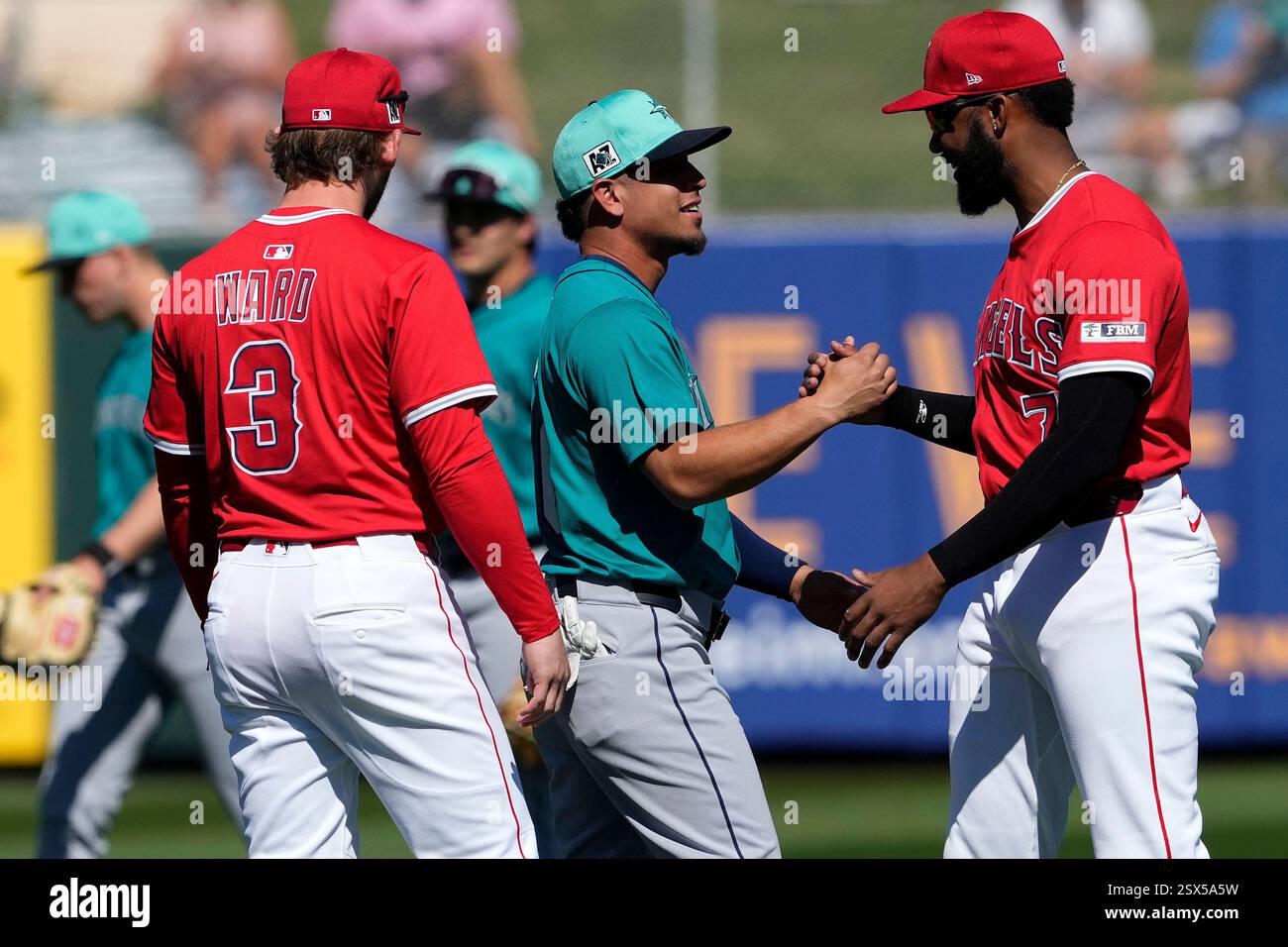 Los Angeles Angels' Taylor Ward (3) and Jo Adell greet Seattle Mariners ...