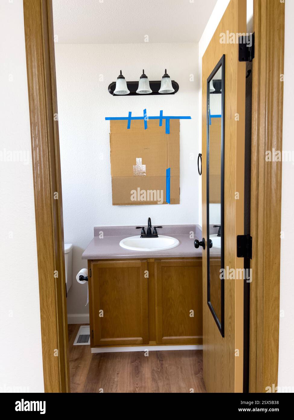 Bathroom Mirror Replacement Preparation Stock Photo - Alamy