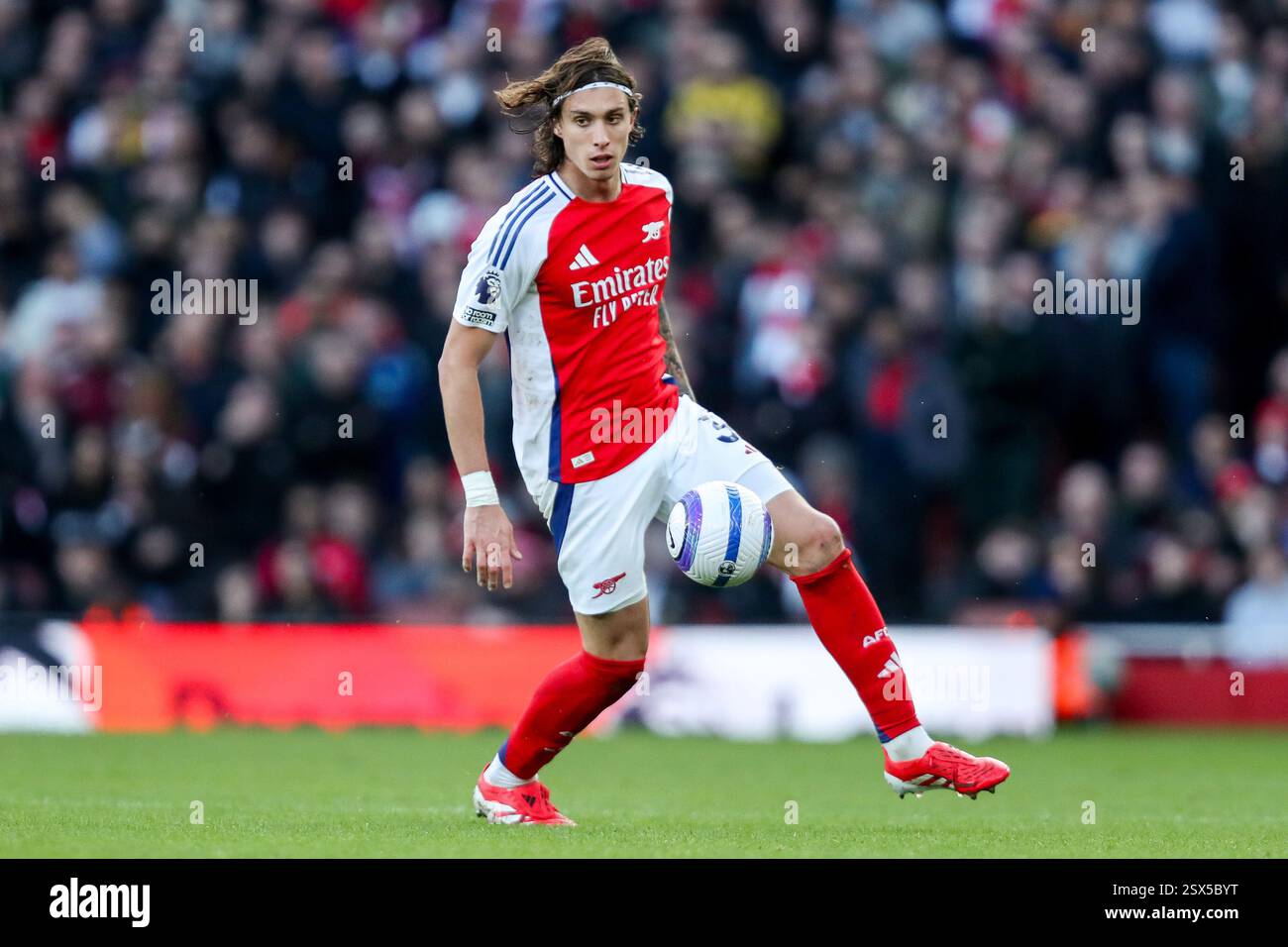 Riccardo Calafiori of Arsenal controls the ball during the Premier ...