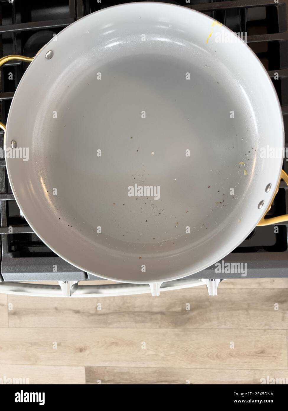 Modern White Pan on Gas Stove Top Stock Photo - Alamy