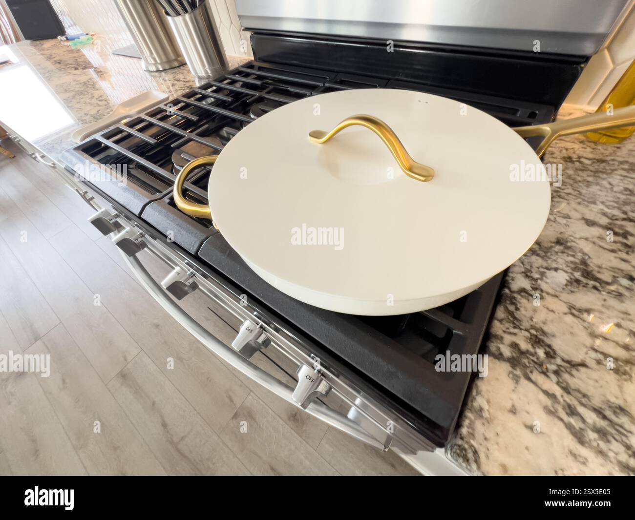 Modern White Pan on Gas Stove Top Stock Photo - Alamy