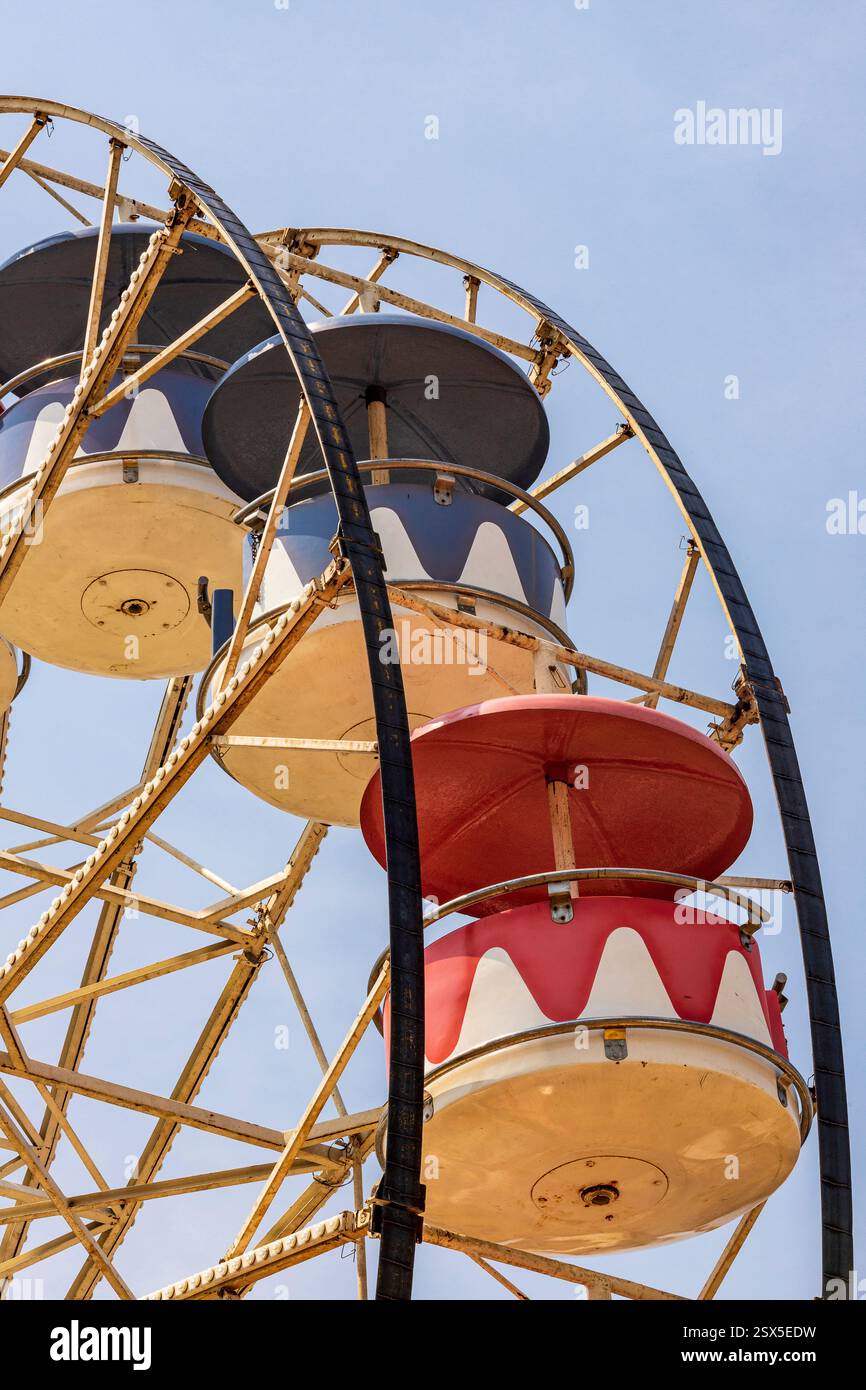 Colorful giant wheels in park amusement with blue sky on background ...