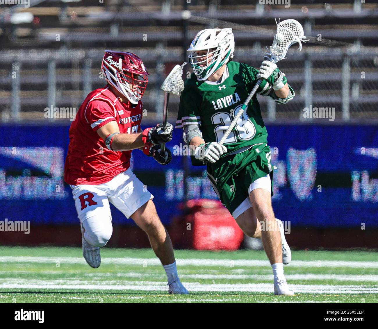 February 22, 2025: Loyola Maryland midfielder Luke Murphy (28) looks to ...