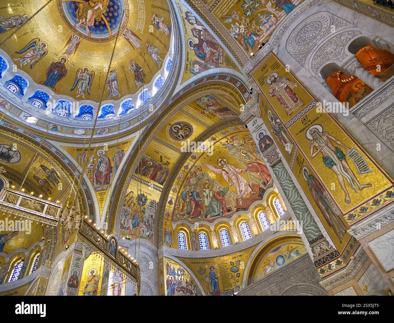 Elaborate interior of a Byzantine-style church with golden mosaics ...