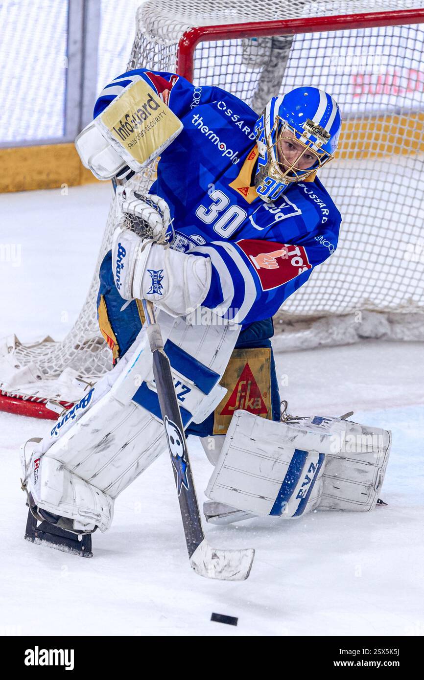 Goalkeeper Leonardo Genoni #30 (EV Zug) frees the puck - 22.02.2025 ...