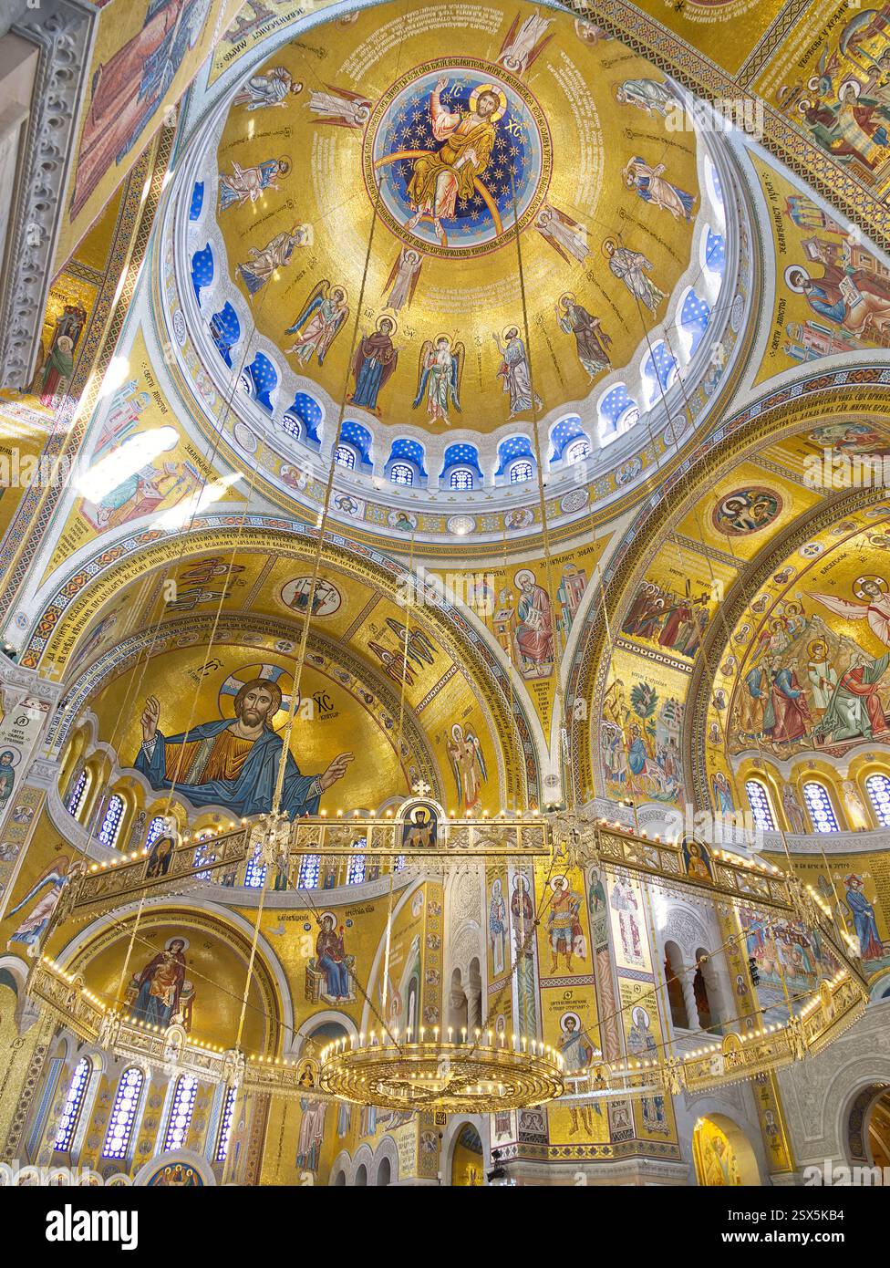 Stunning interior of a Byzantine-style cathedral with elaborate golden mosaics and religious ...