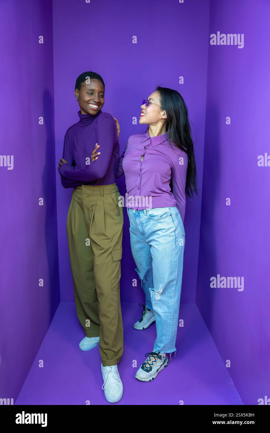 Fashionable Friends Posing Together in a Vibrant and EyeCatching Purple ...
