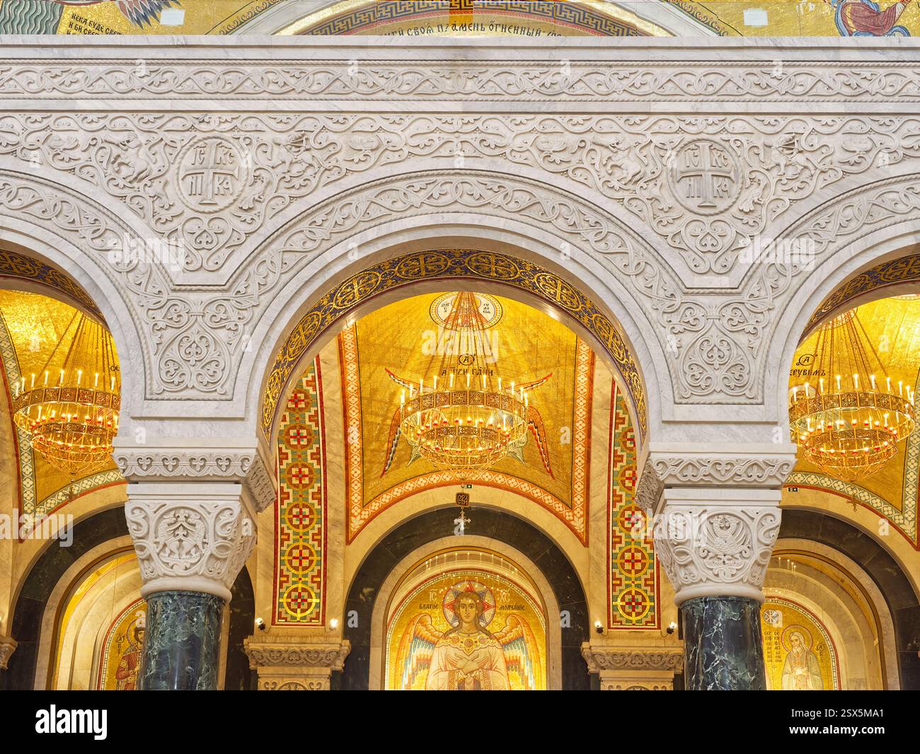 Elaborate Byzantine-style church interior with intricate carvings, golden mosaics, and ...