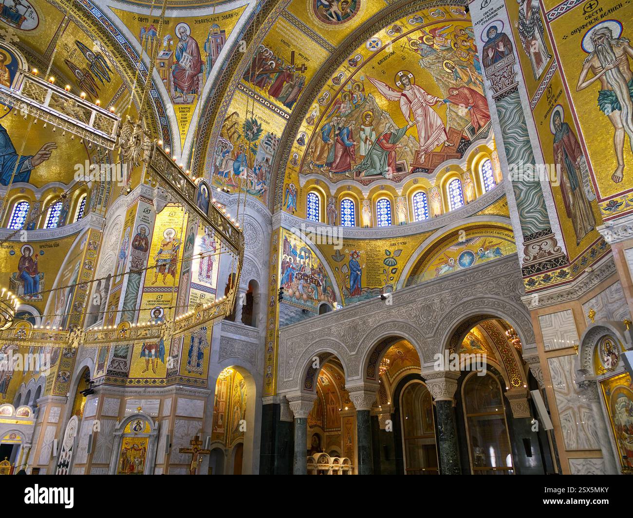 Stunning interior of a Byzantine-style church with elaborate golden mosaics and arched ...