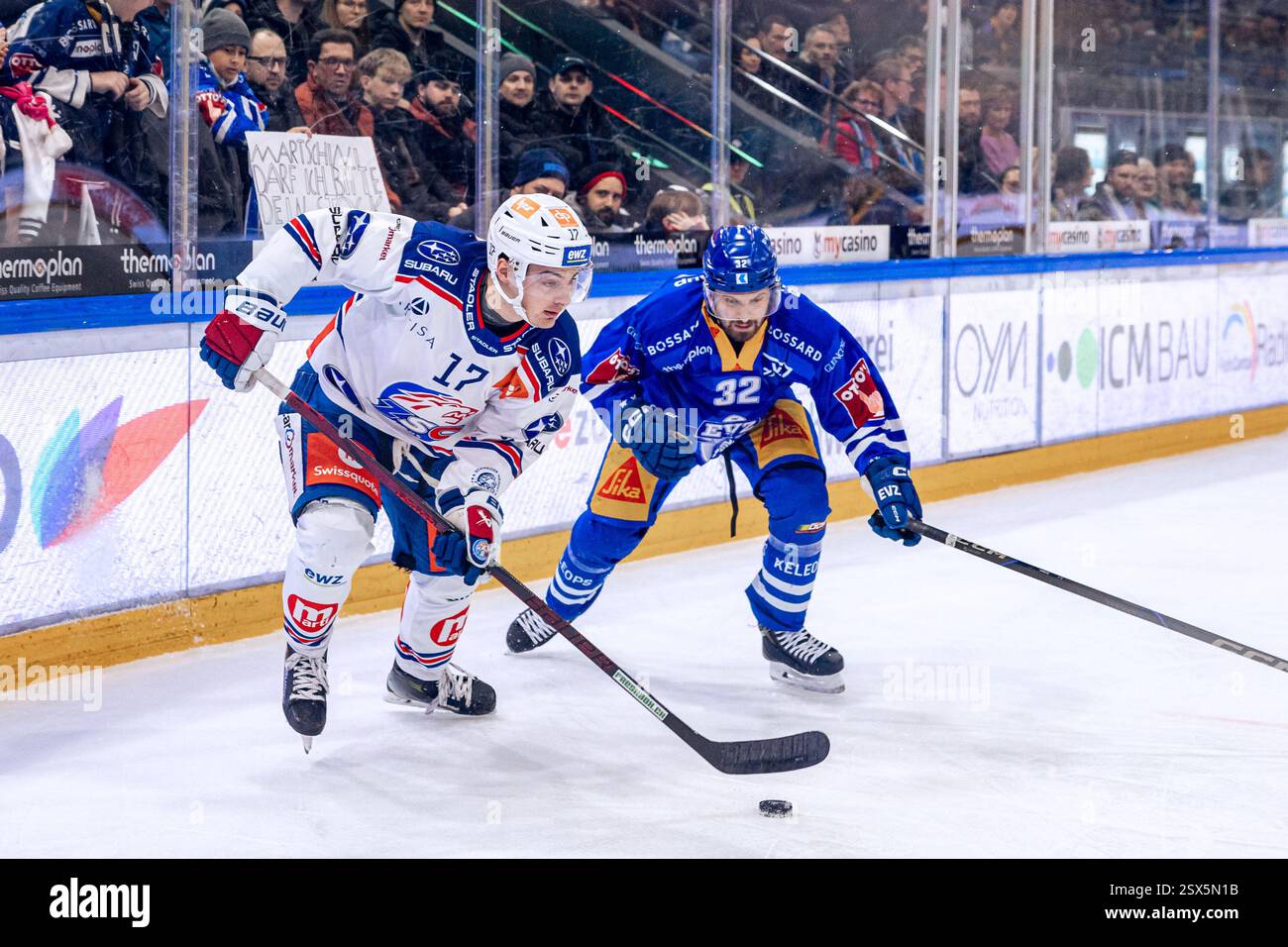 Alessandro Segafredo #17 (ZSC Lions) escapes Lukas Bengtsson #32 (EV ...